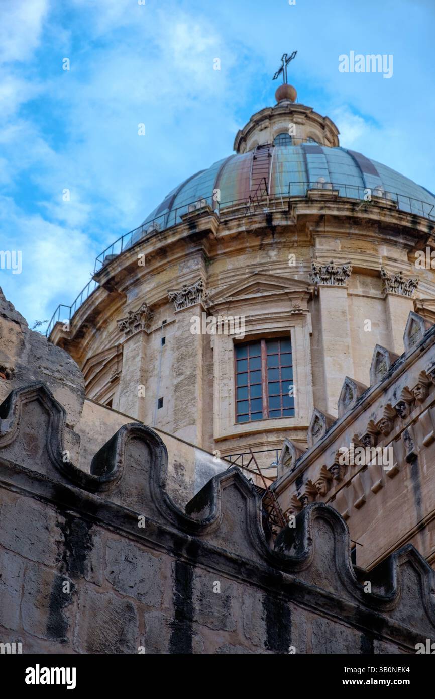 Palermo Cathedral's dome rises against the sky. Built over centuries ...