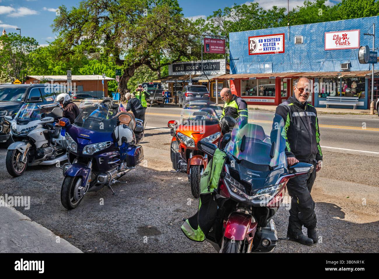 Group of motorcycle riders getting ready to go, Main Street in Bandera ...