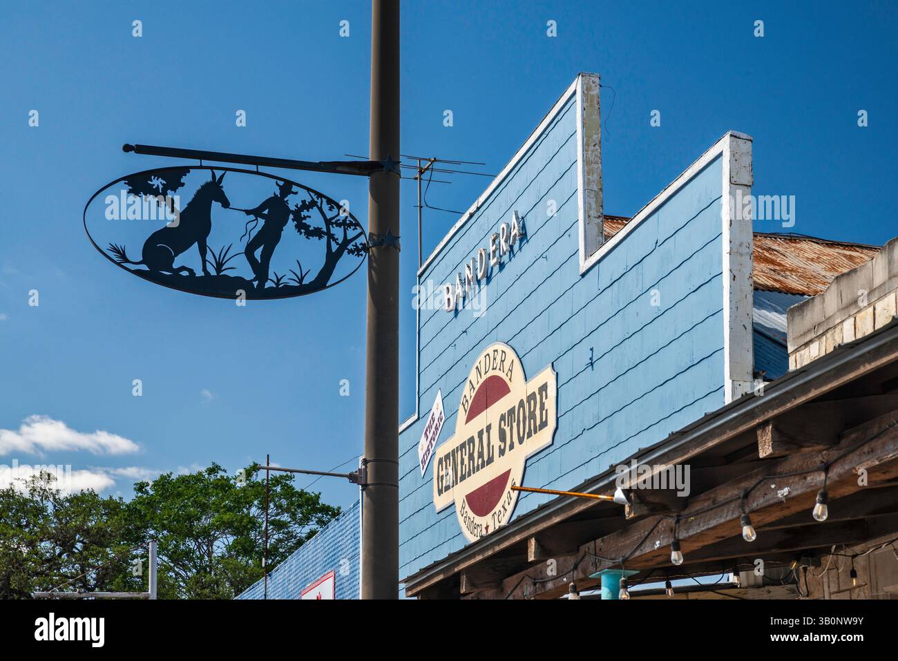 Wrought iron sign, traditional store front, Main Street in Bandera ...