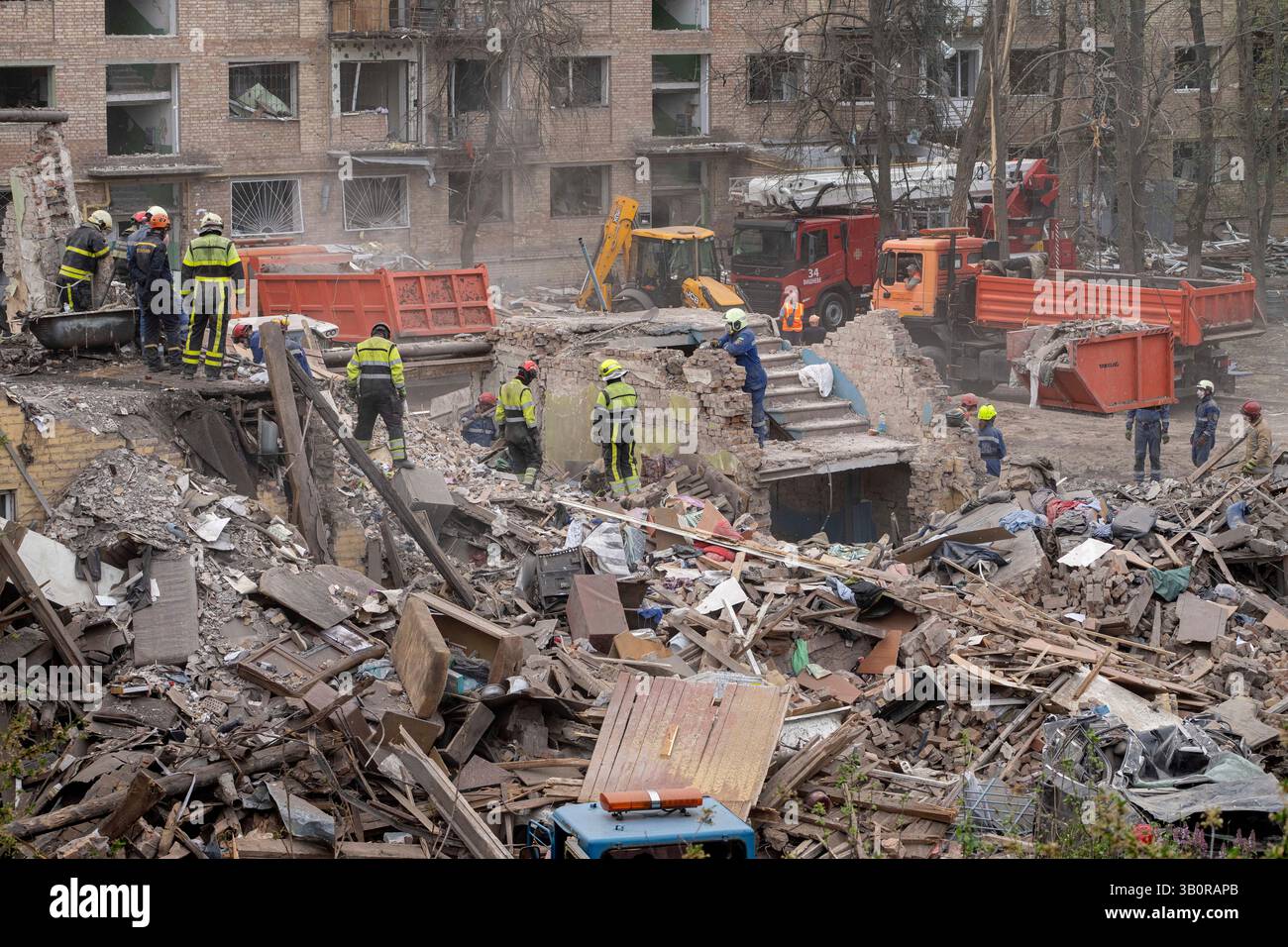 Rescue services on site of destruction looking for trapped people under ...