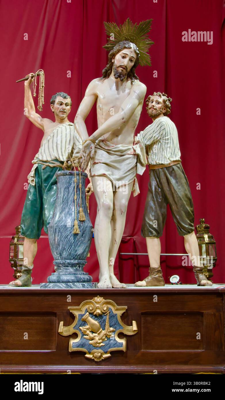 Paso with life-size wooden statues with two men flogging Jesus Christ ...