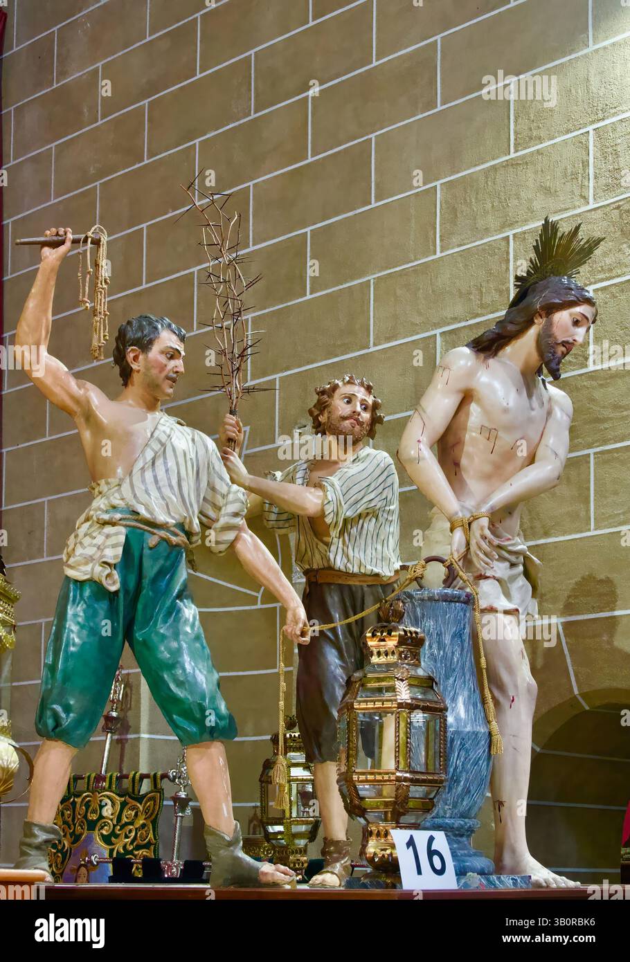 Paso with life-size wooden statues with two men flogging Jesus Christ ...