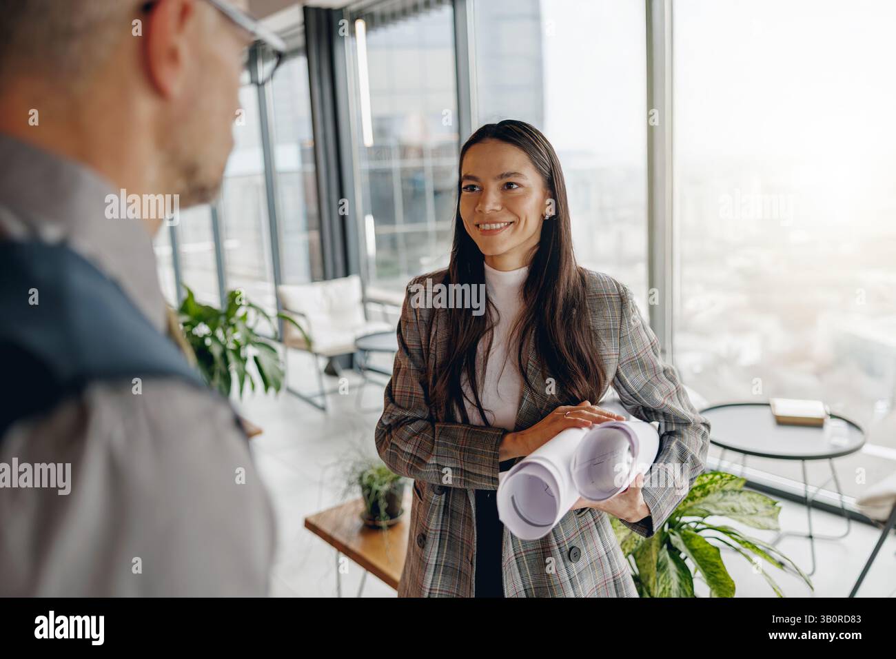 A dynamic business meeting taking place in a modern office setting ...