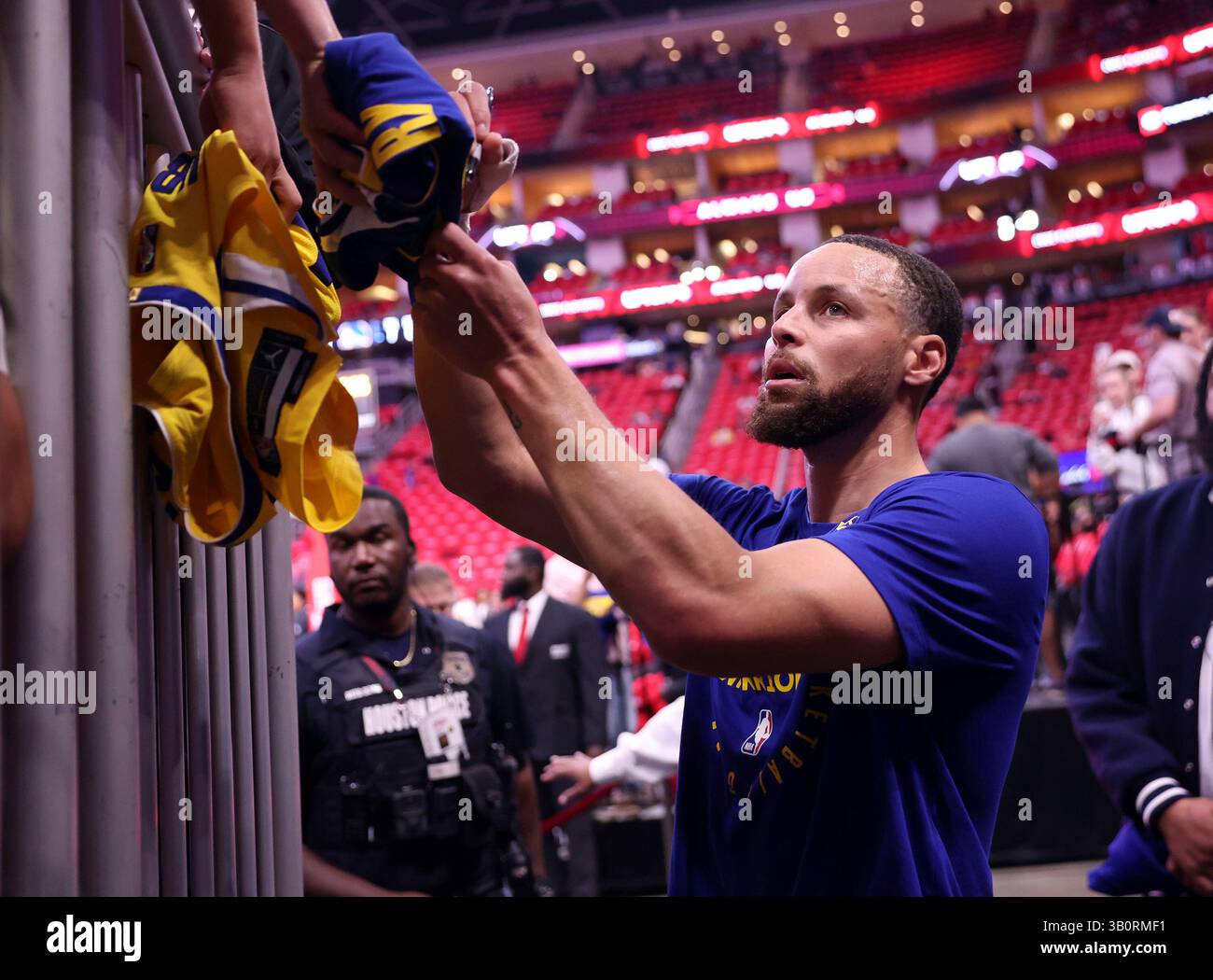 Golden State Warriors' Stephen Curry signs an autograph before playing ...