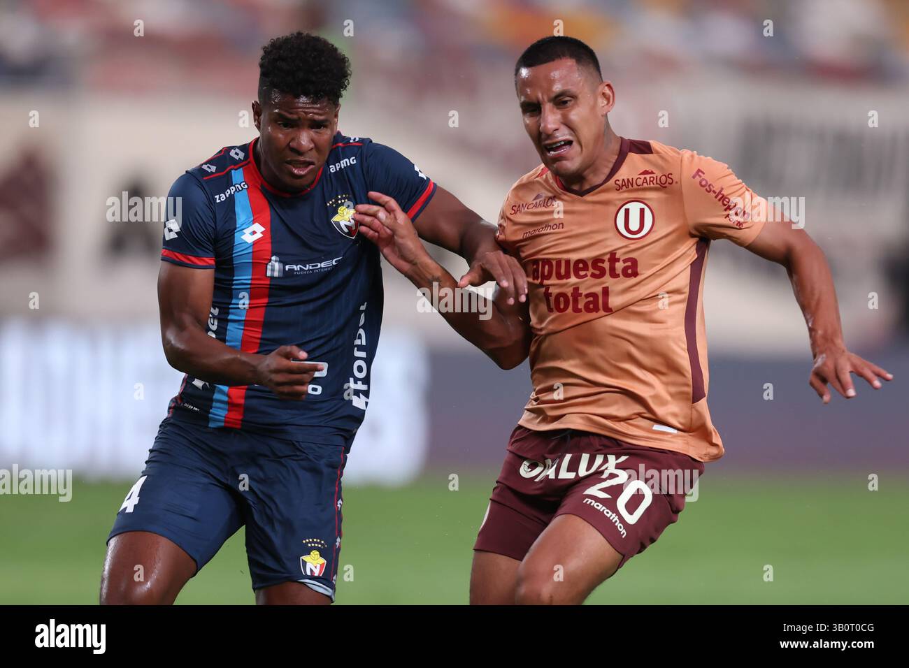 Rommel Andres Cabezas of El Nacional and Alex Valera of Universitario ...