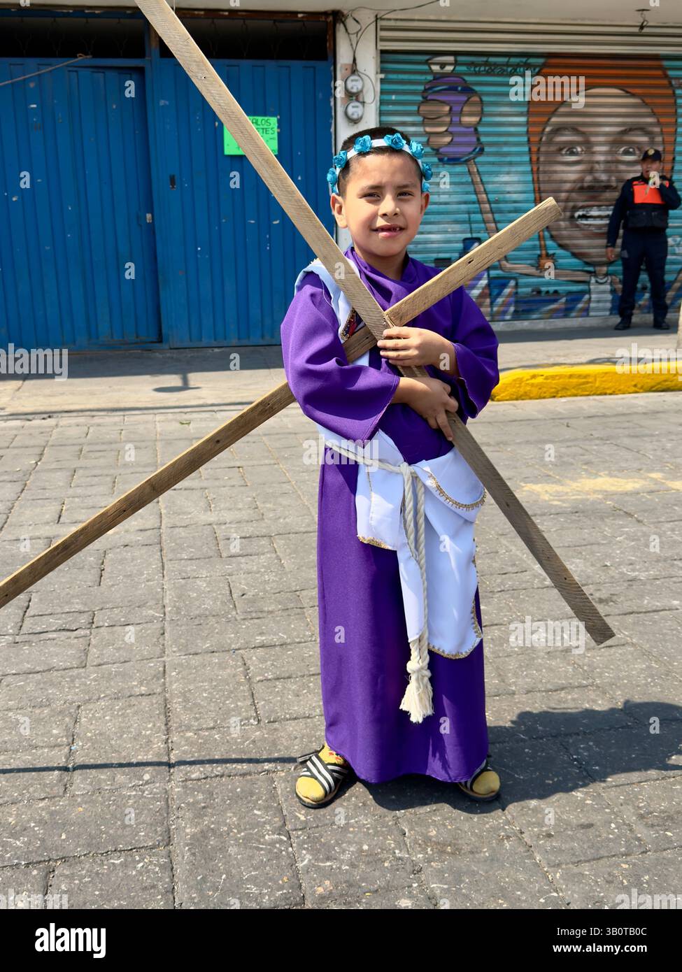 On Holy Friday in Iztapalapa, faithful child carry large wooden cross ...