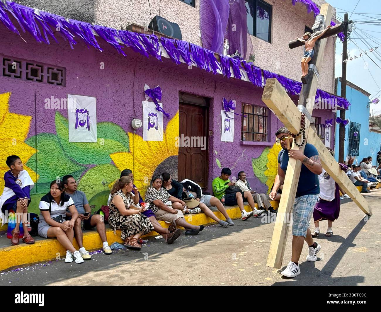 On Holy Friday in Iztapalapa, faithful people carry large wooden ...