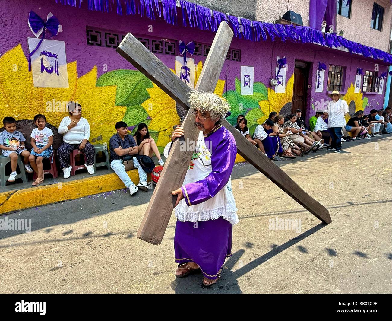 On Holy Friday in Iztapalapa, faithful people carry large wooden ...