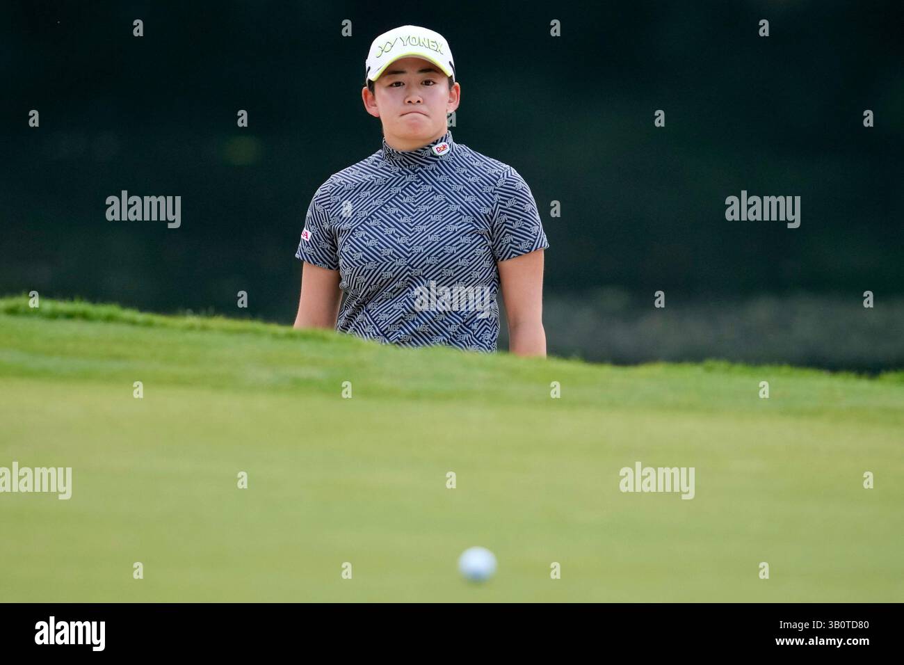 Akie Iwai, of Japan, looks at her shot on the 12th hole during the ...