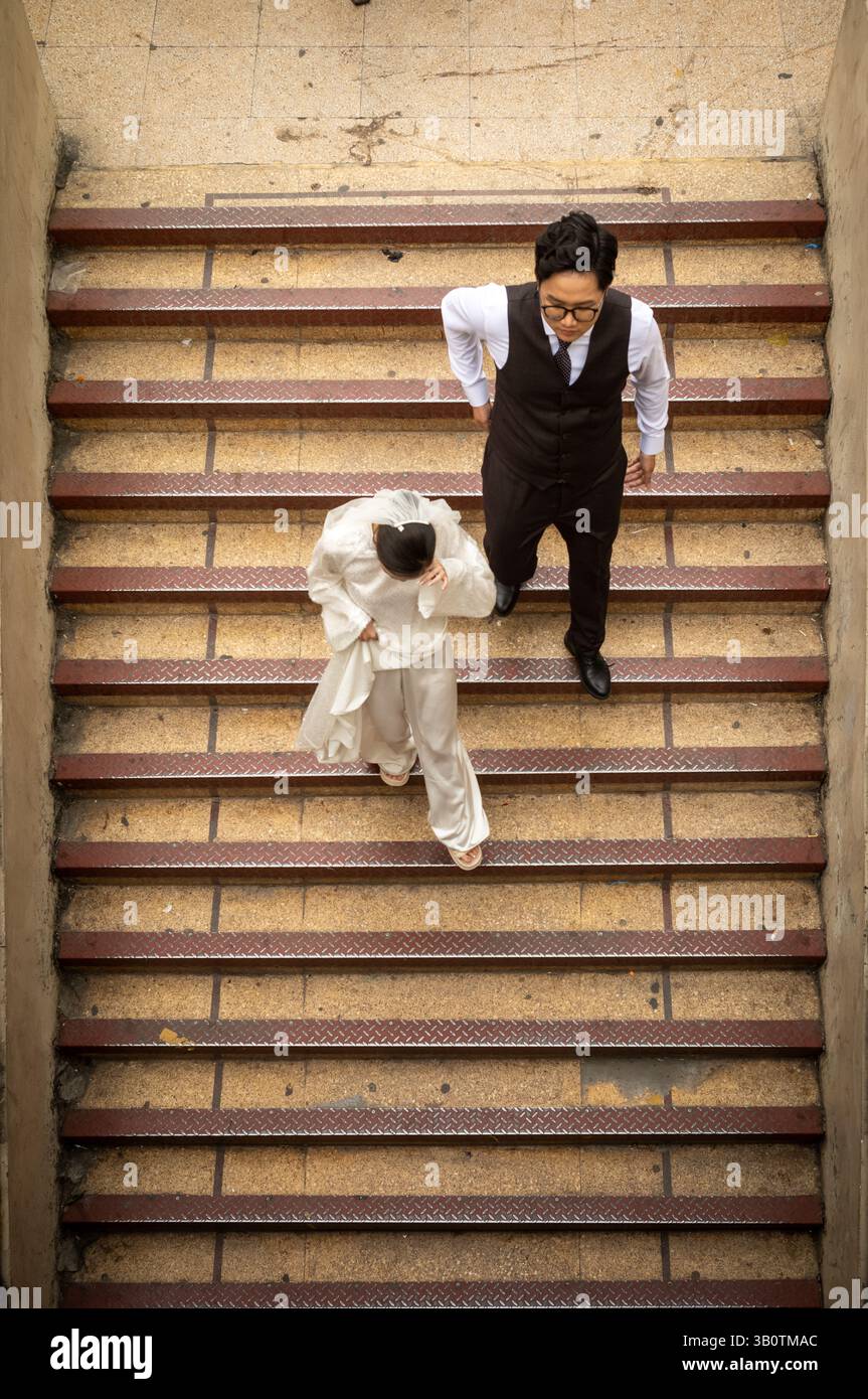 Young couple descend steps hi-res stock photography and images - Alamy