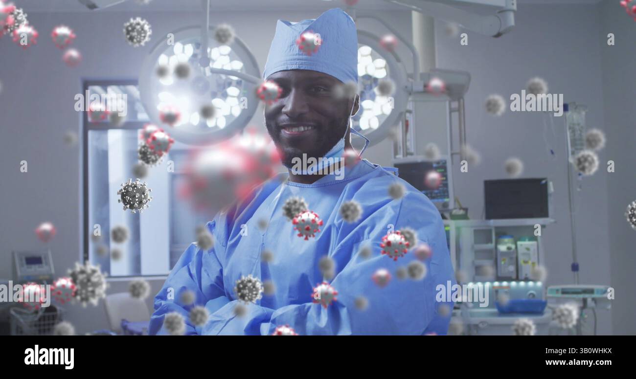 African American male surgeon standing in operating room, with surgical ...