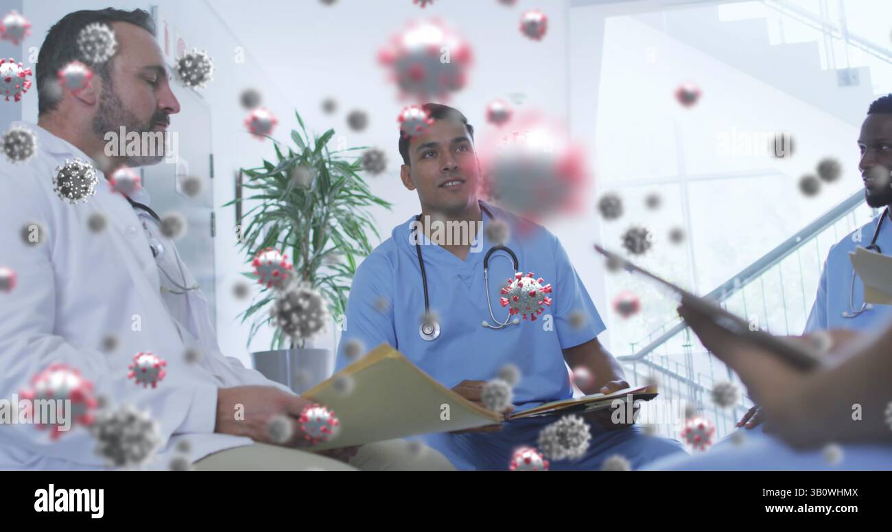 Diverse medical team reviewing files and discussing pandemic response ...