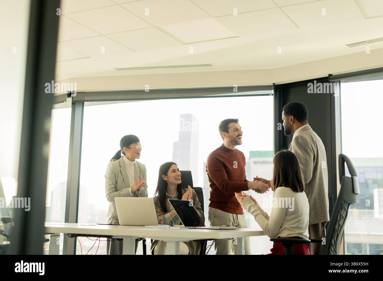 A diverse group of professionals engages in a dynamic brainstorming ...