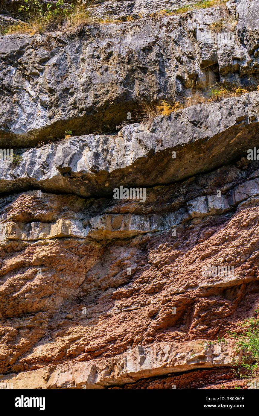 Layers of vibrant sedimentary rock rise majestically along the Boljetin ...