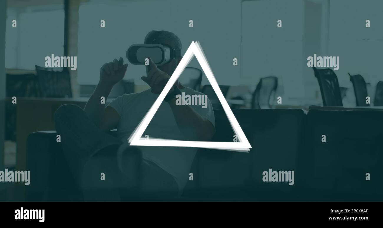 Image of triangles rotating over caucasian man wearing vr headset in ...
