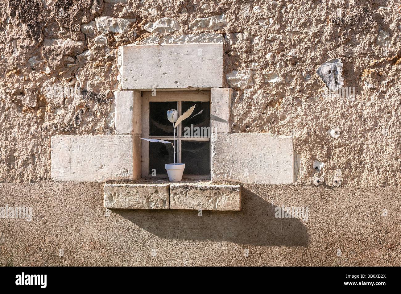 Small window using large limestone block construction with false white ...
