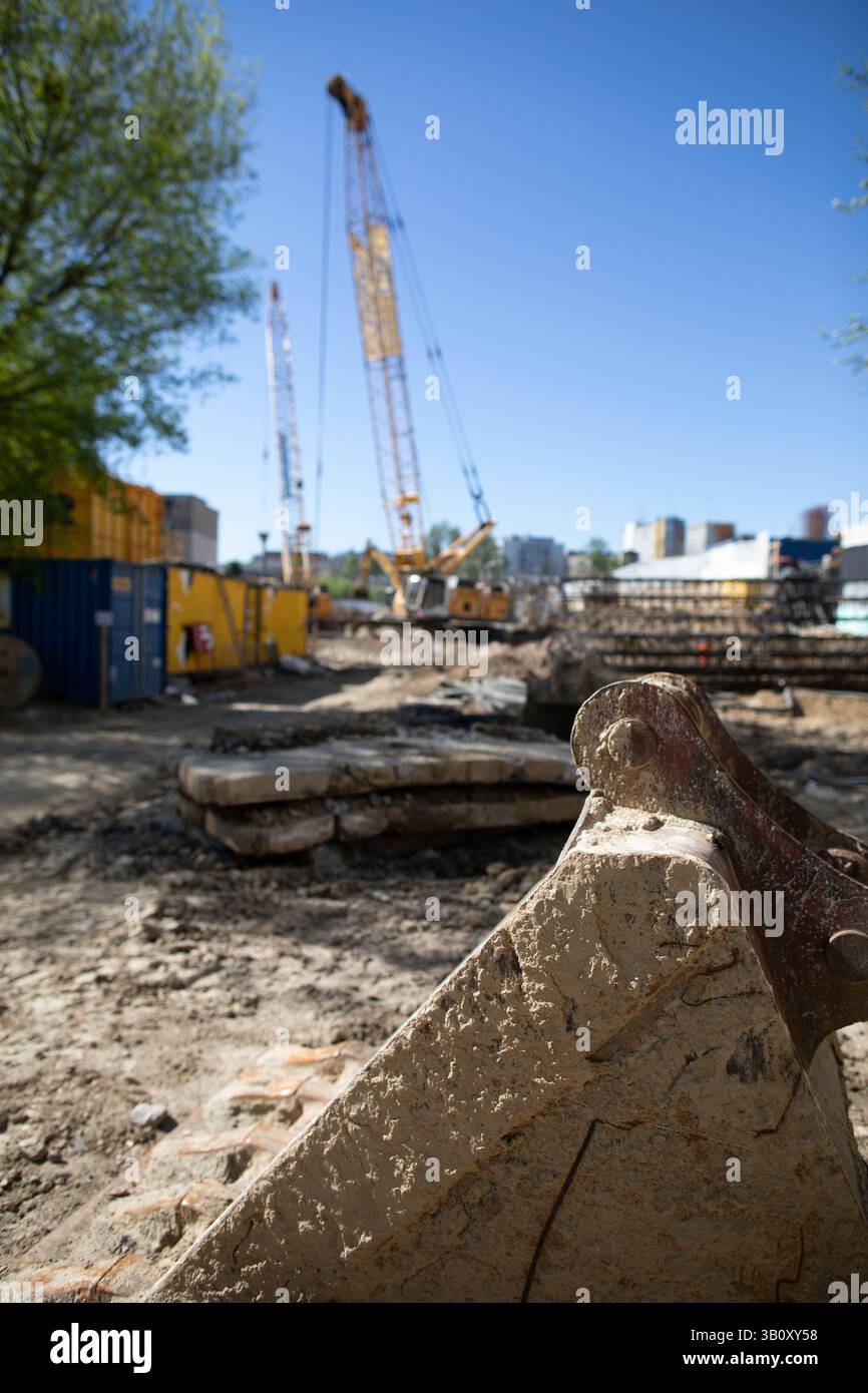 A bustling Construction Site showcasing Cranes and Heavy Machinery ...
