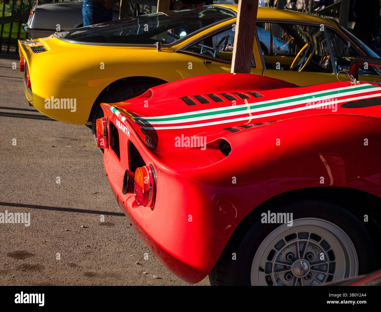 A display of colourful racing cars in the paddock at the 82 Members Meeting, Goodwood Motor ...