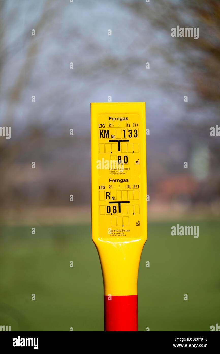 Marker post for a gas pipeline; a gas pipeline runs under the sign ...