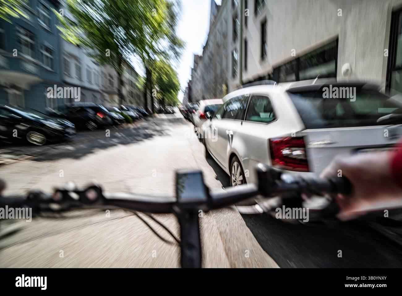 Cycling in the city, inner-city road, cycle lane, bicycles have right ...