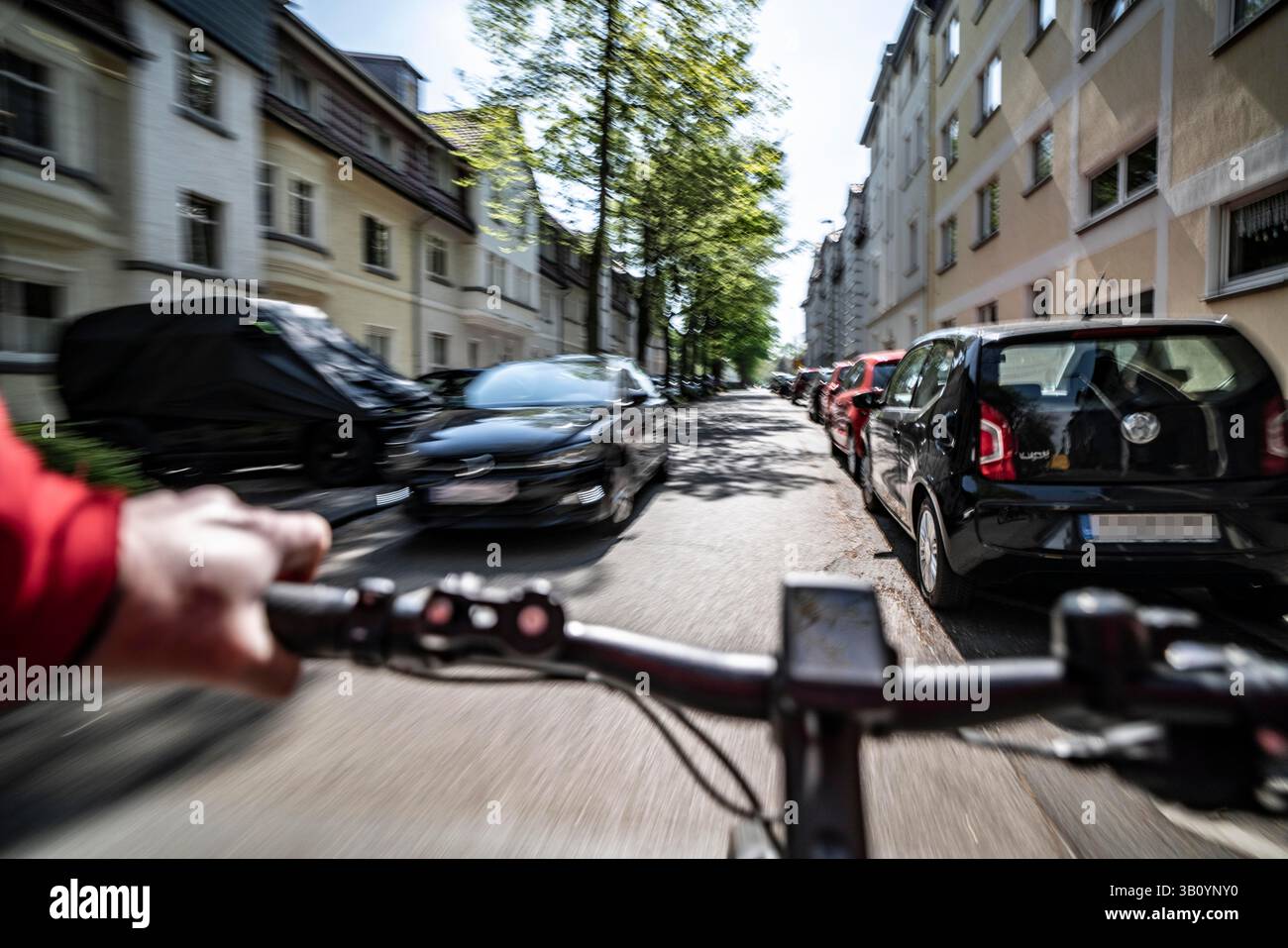 Cycling in the city, inner-city road, cycle lane, bicycles have right ...