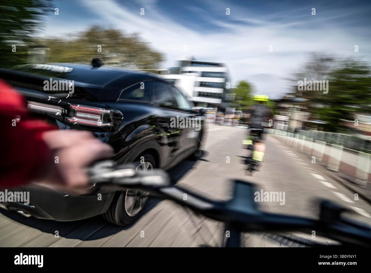 Cycling in the city, inner-city road, cycle lane, bicycles have right ...