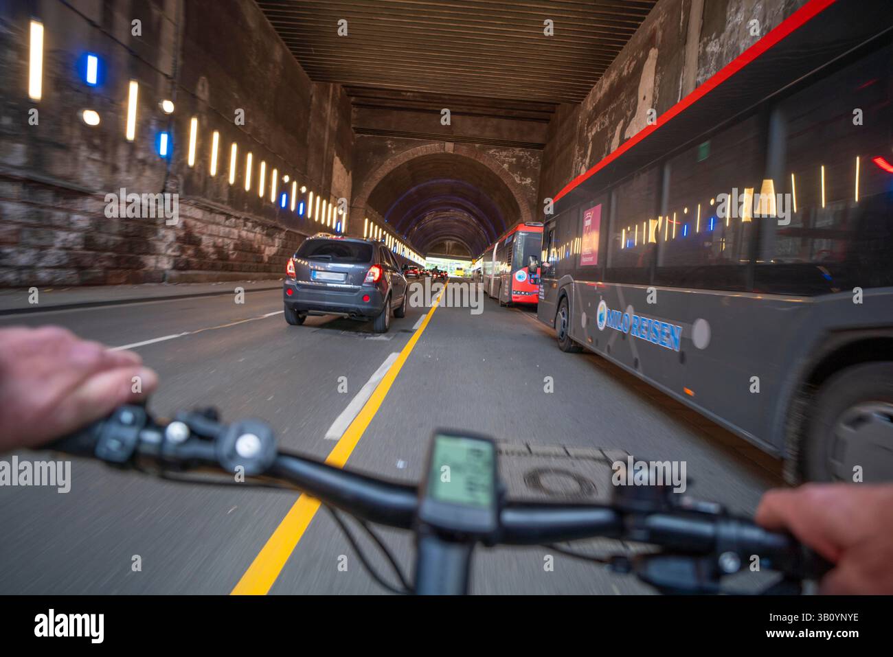 Cycling in the city, inner-city road, no cycle path, tunnel, two-lane ...