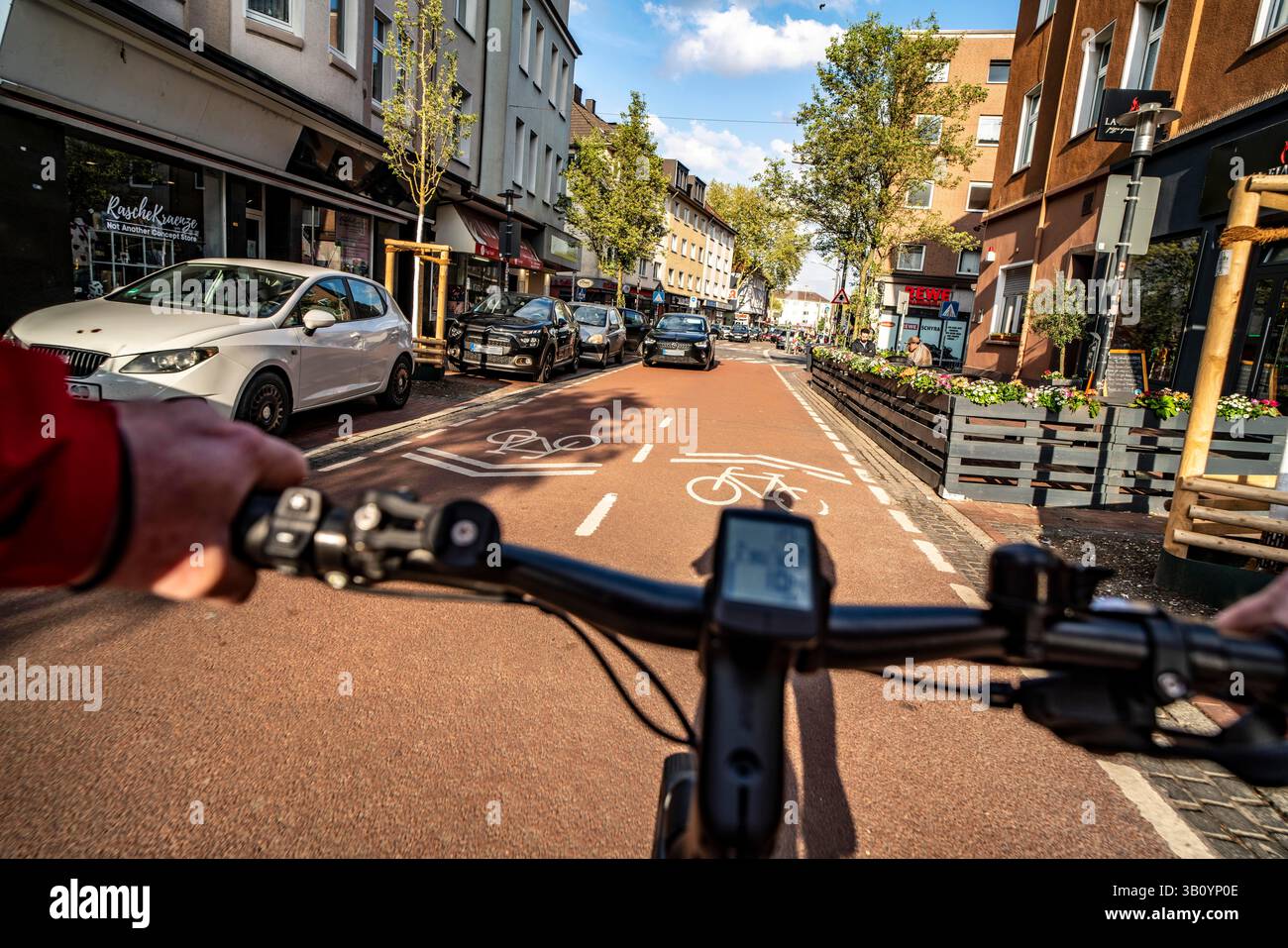 Cycling in the city, inner-city road, cycle lane, bicycles have right ...