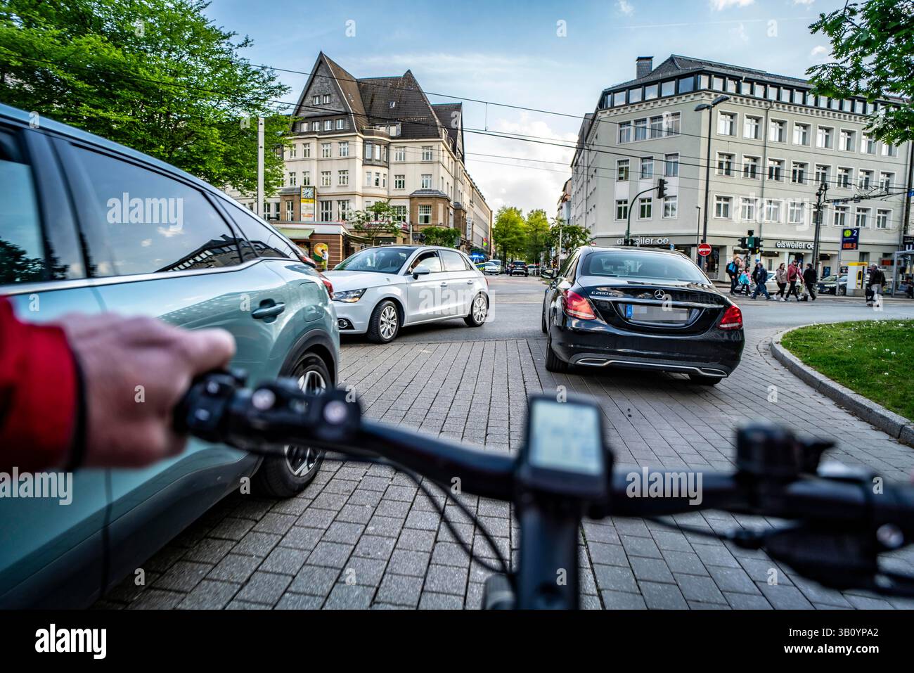 Cycling in the city, inner-city road, cycle lane, bicycles have right ...