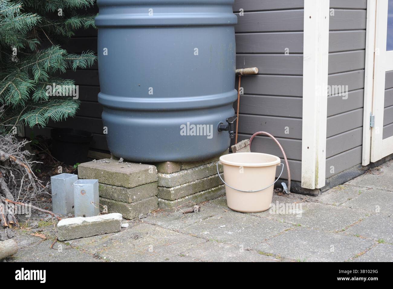 Rain barrel with which through a tap the collected water can be put ...