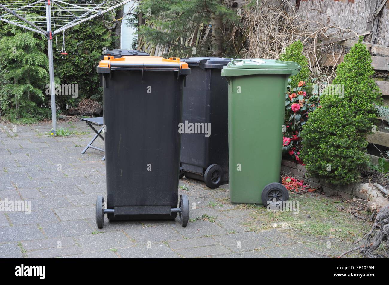 Containers in different colours for collecting different types of waste ...