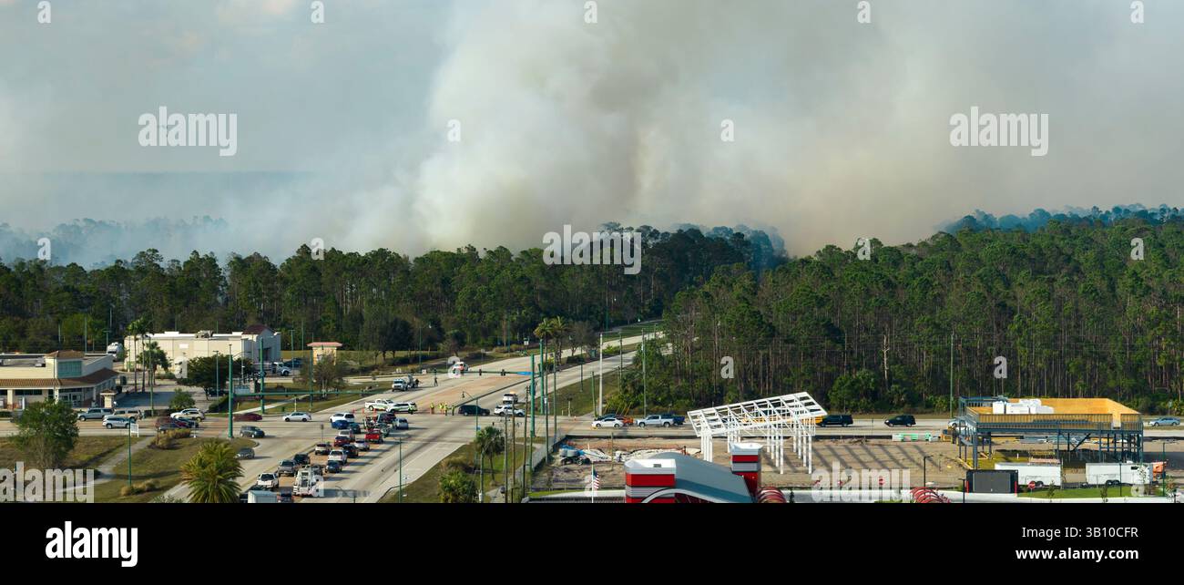 Aerial view of strong wildfire burning severely in North Port city ...