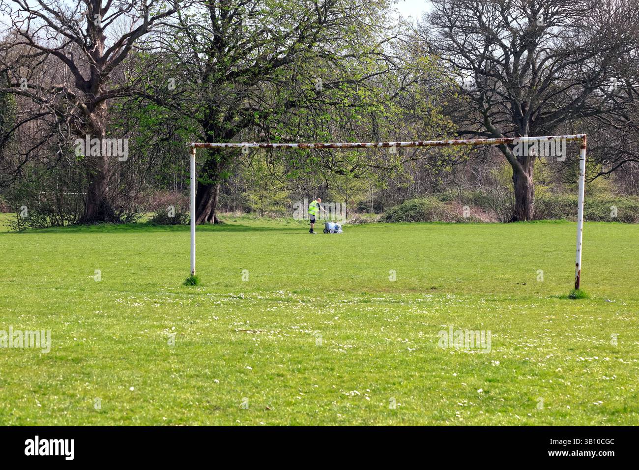 Man marking football pitch with white line painter, Llandaff Fields ...