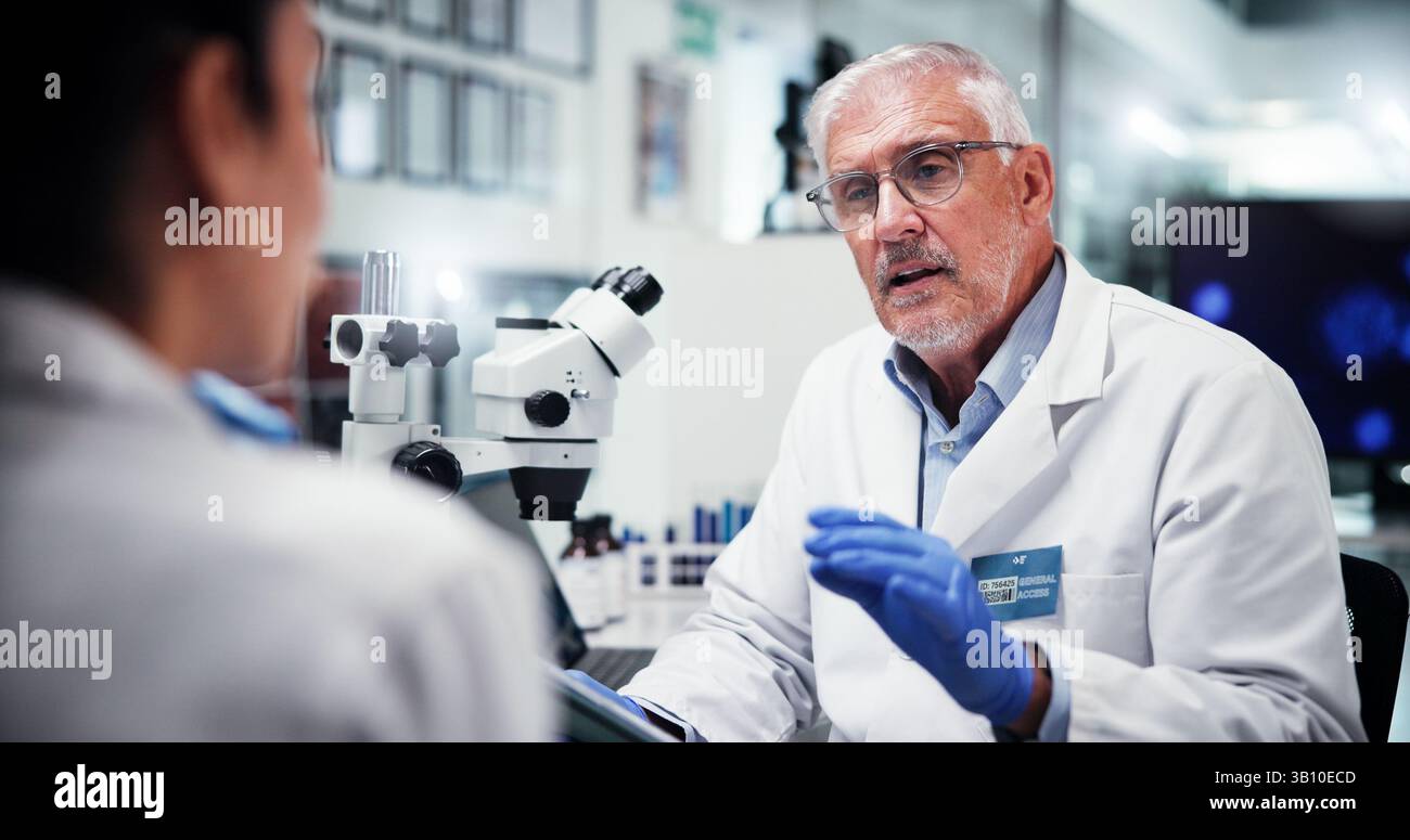 Mature, scientist and man with colleague in laboratory, feedback or ...