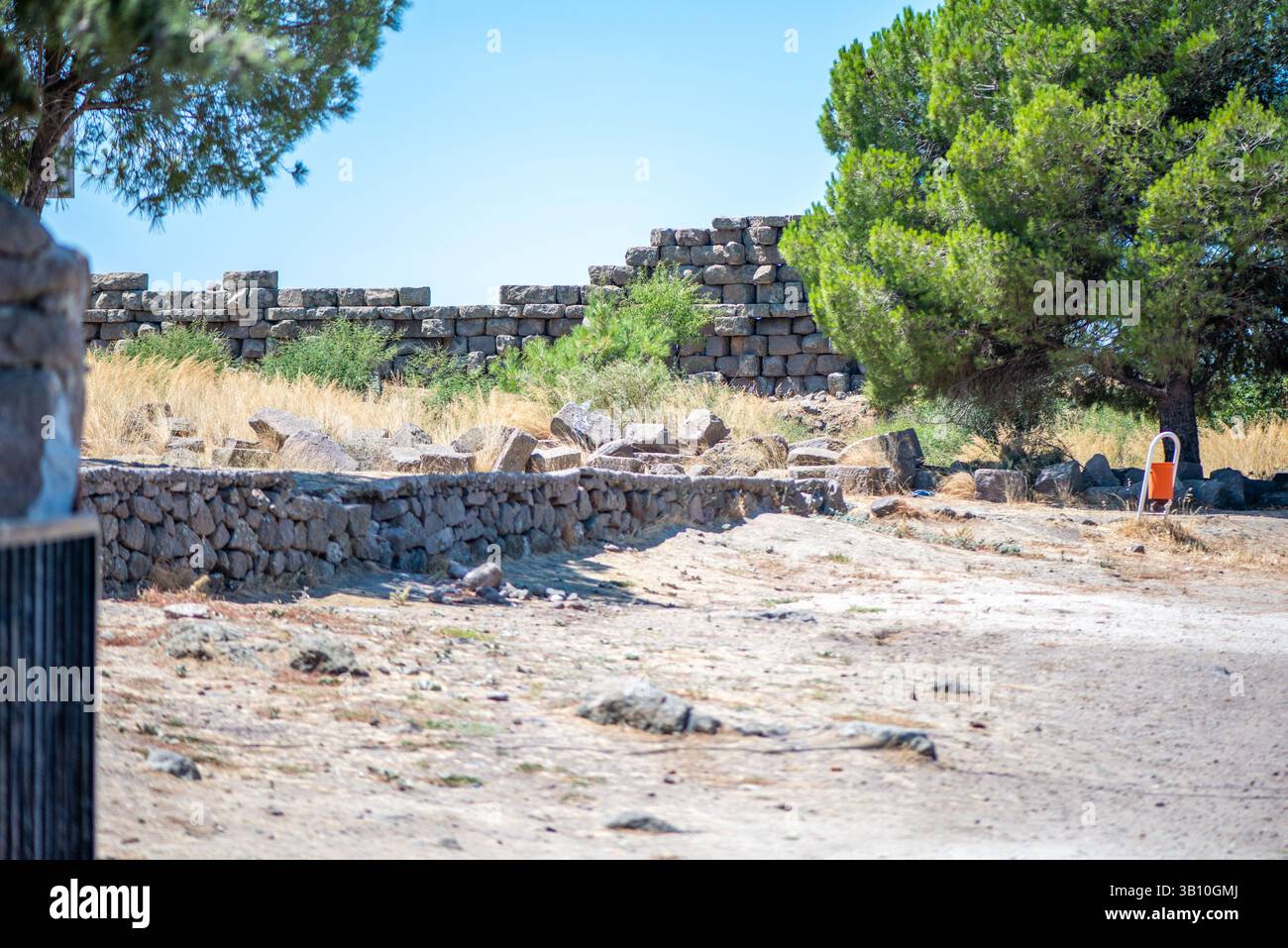 A close-up view of the weathered stone walls and structural parts of an ...