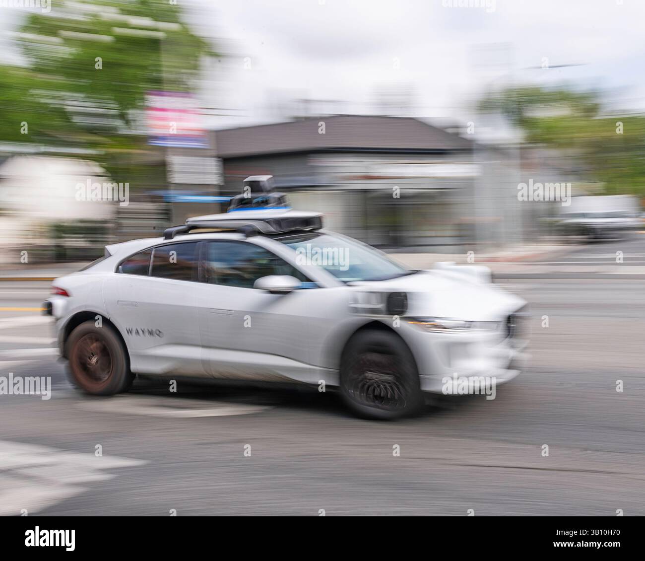 Los Angeles, CA, USA: April 24, 2025: Waymo, a self-driving car, drives ...