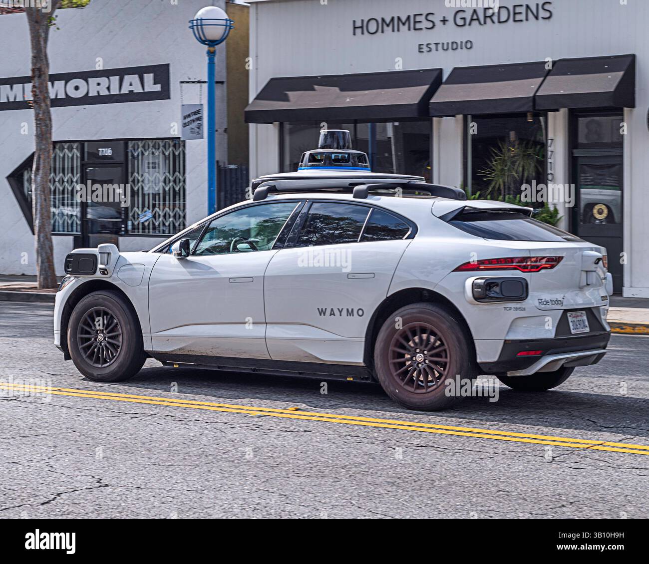 Los Angeles, CA, USA: April 24, 2025: Waymo, a self-driving car, drives ...