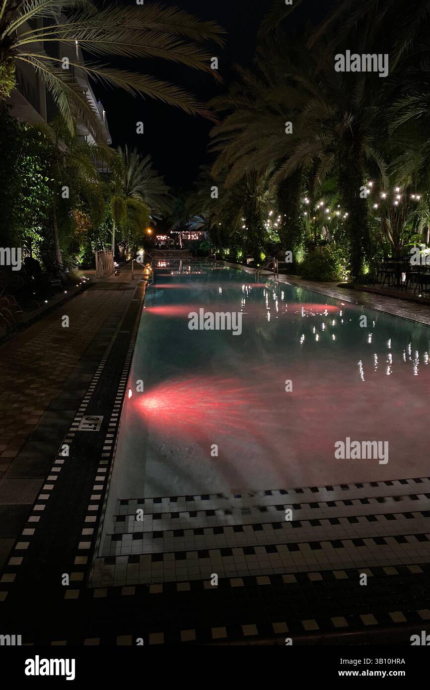 Luxury hotel swimming pool at night in Dubai, United Arab Emirates ...