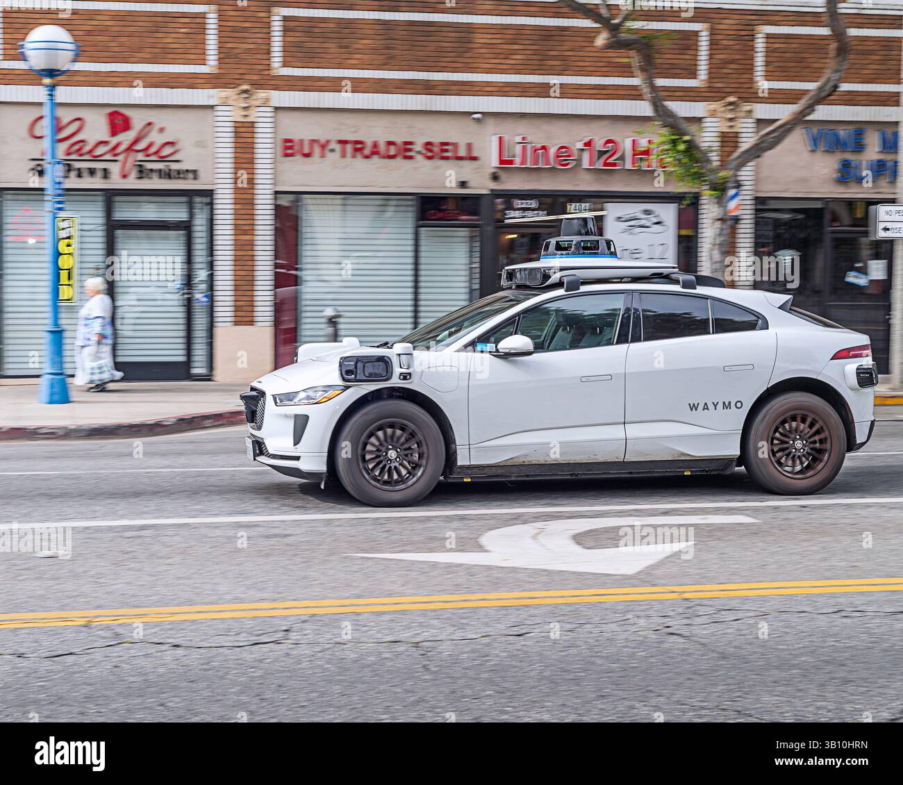 Los Angeles, CA, USA: April 24, 2025: Waymo, a self-driving car, drives ...