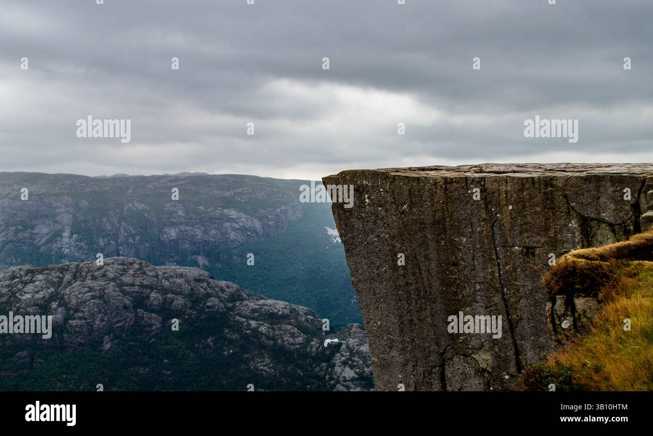 A dramatic and awe-inspiring view of Preikestolen (Pulpit Rock), a ...