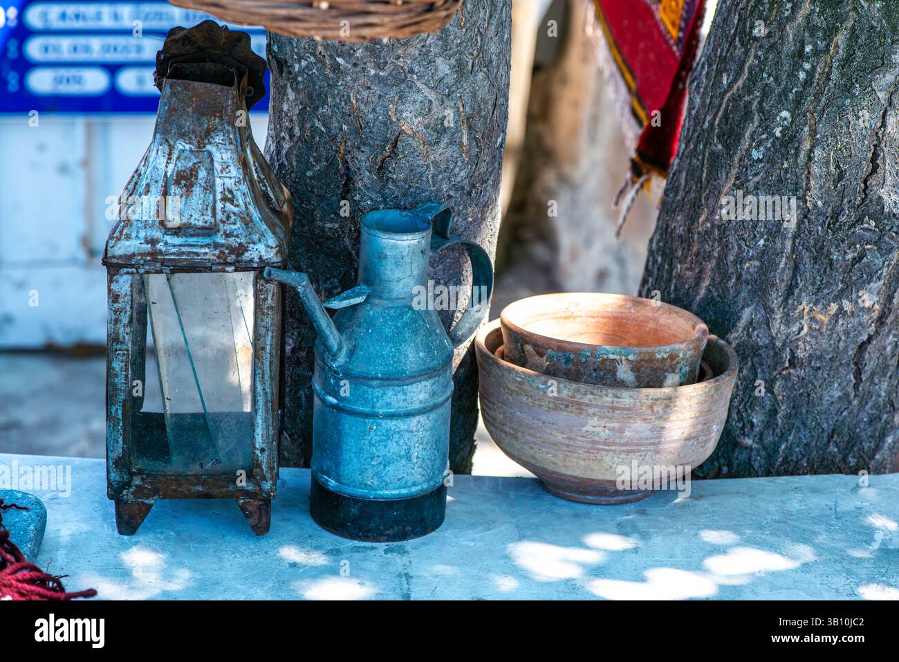 A traditional water jug resting in an ancient village setting ...