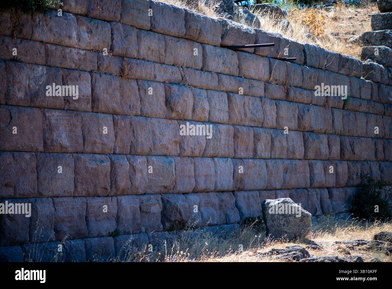 A close-up view of the weathered stone walls and structural parts of an ...