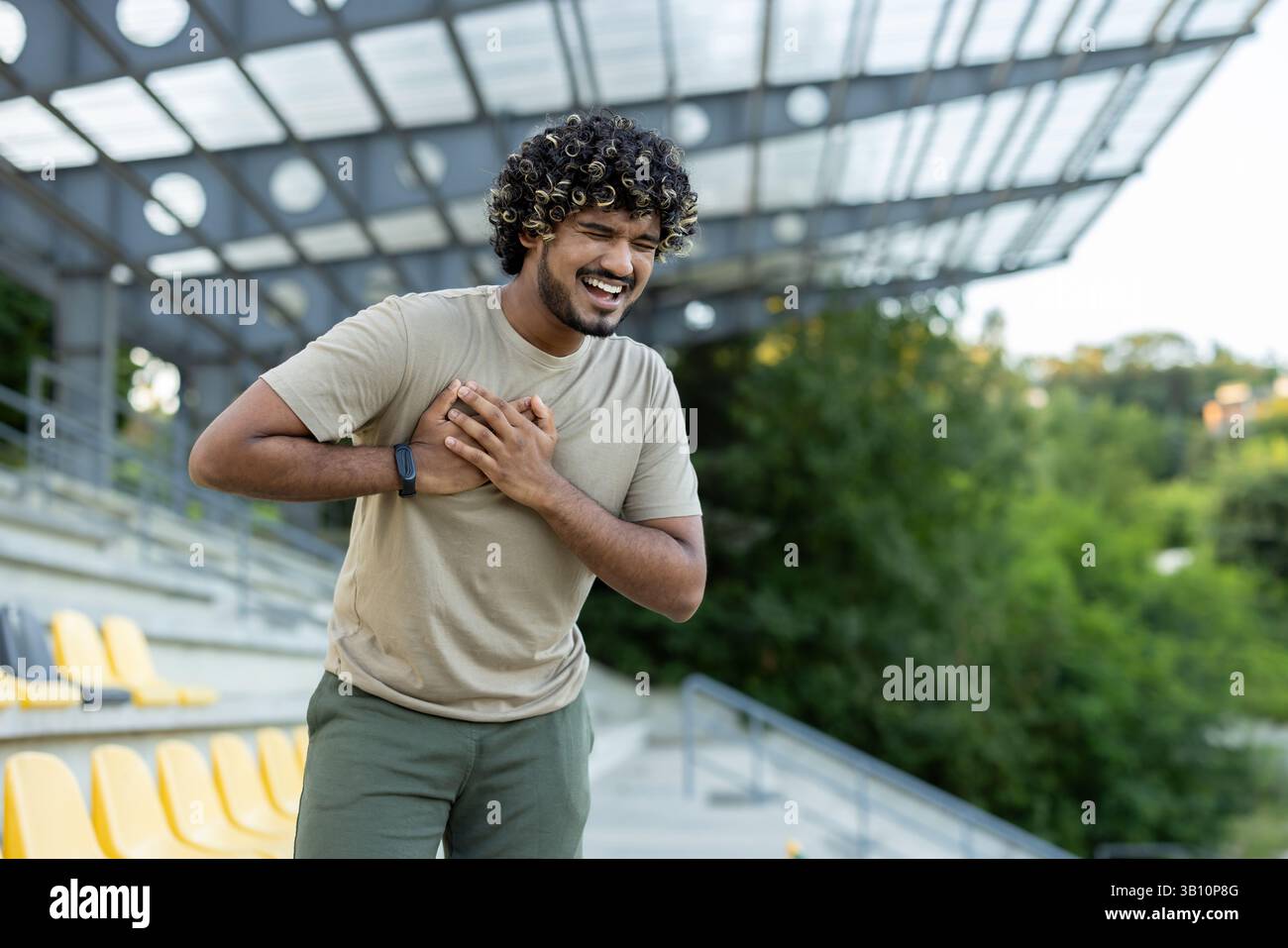 Man suffering from chest pain heart attack during active physical ...