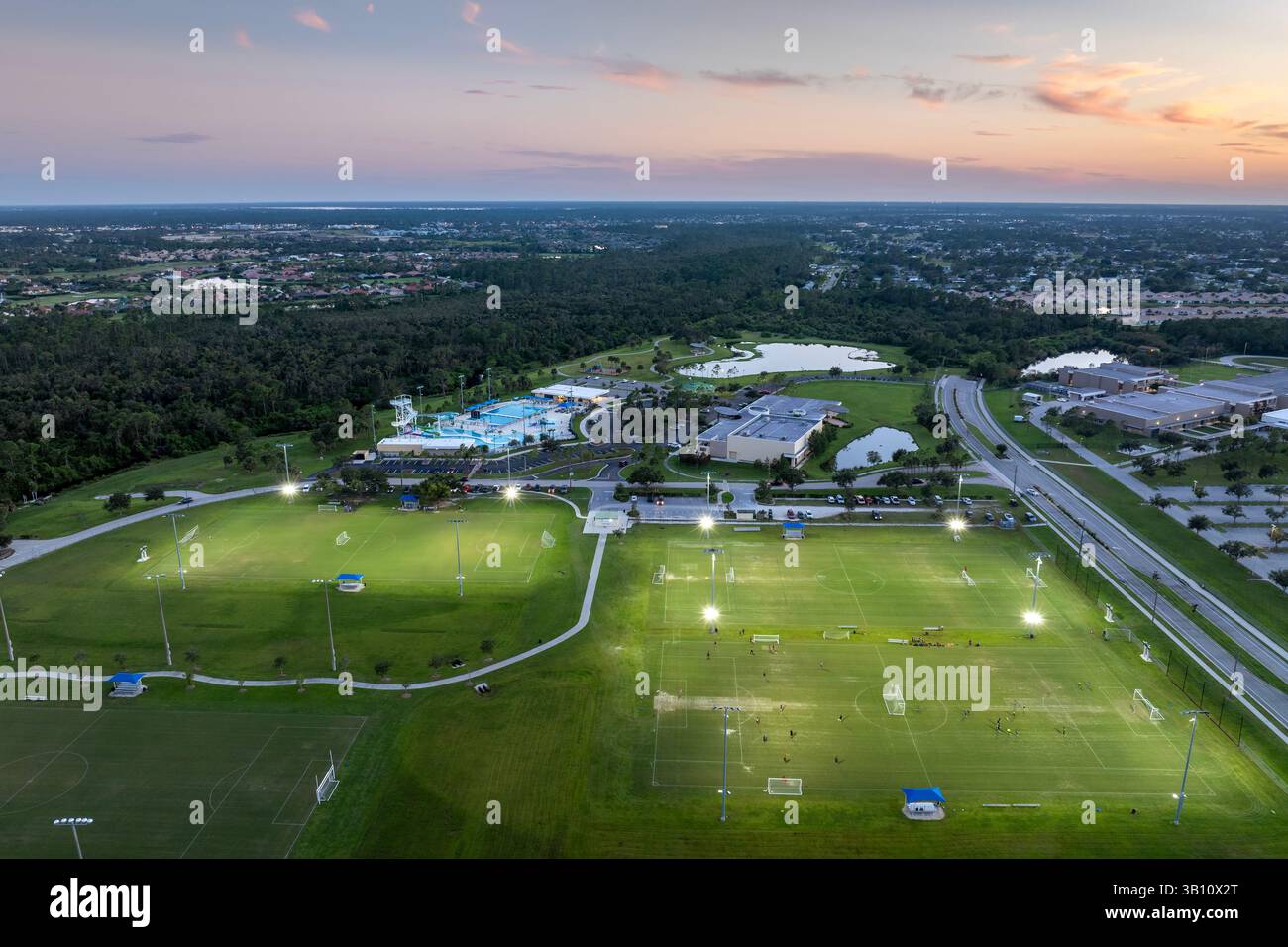 Illuminated public sports arena in North Port, Florida with people ...