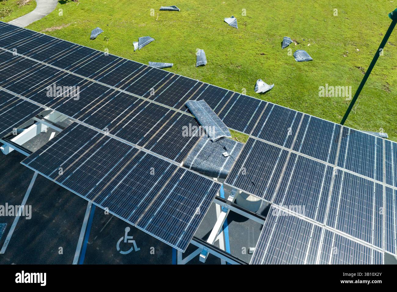 Hurricane wind damage to solar panels installed as shade roof over ...