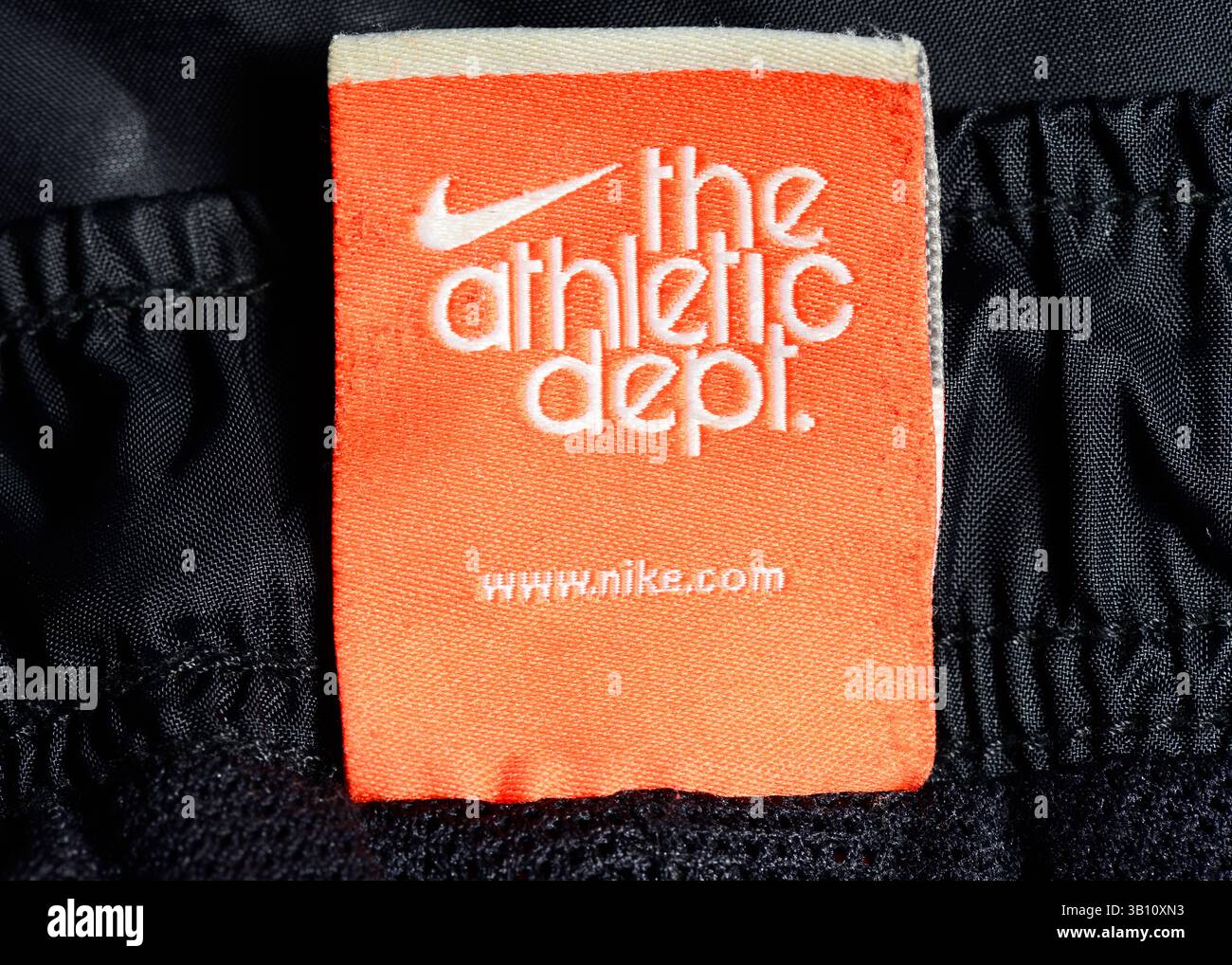 Nike made in Bangladesh orange label on sportswear clothing Stock Photo ...