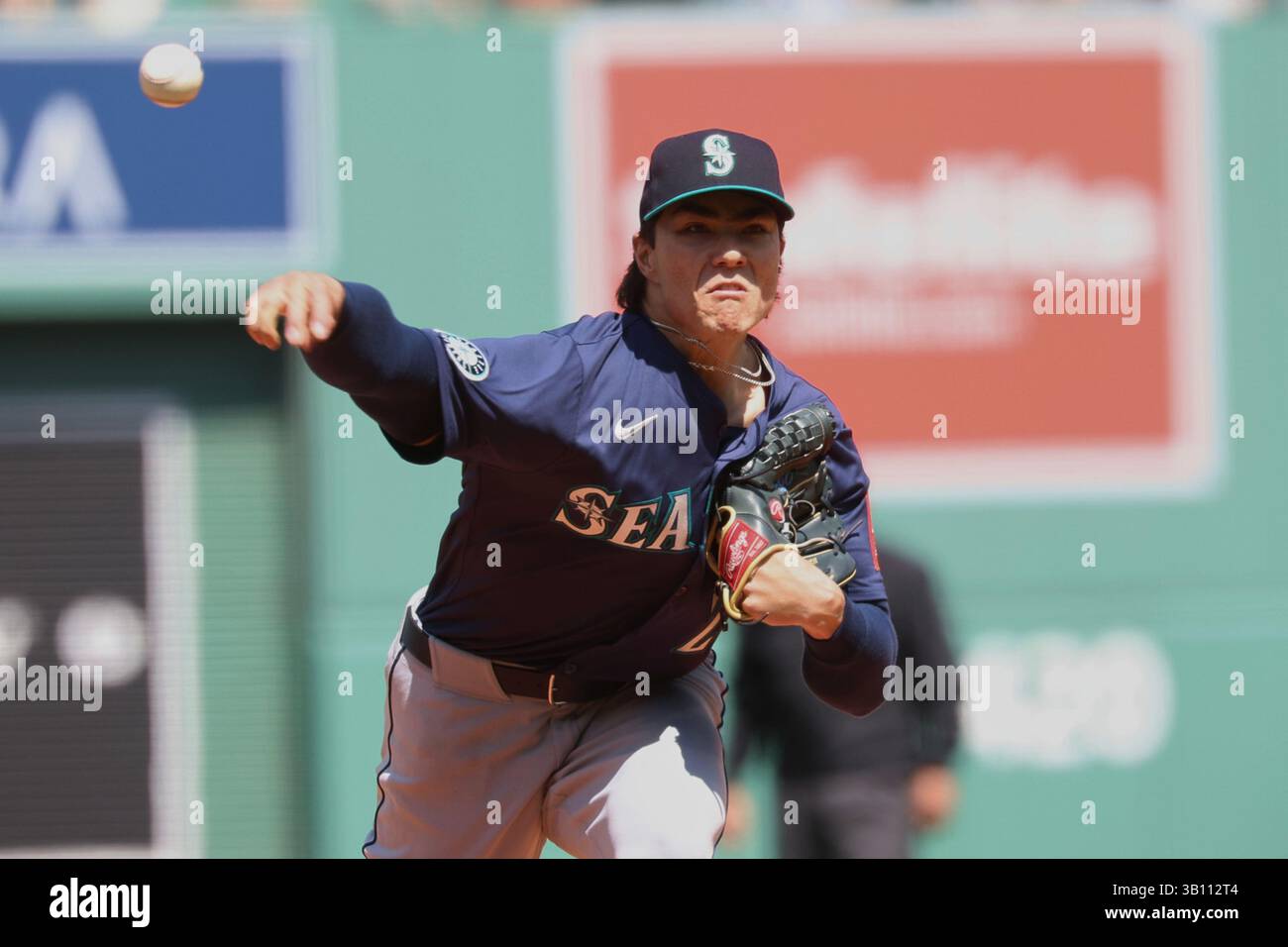 Seattle Mariners pitcher Bryan Woo throws during the first inning of a ...