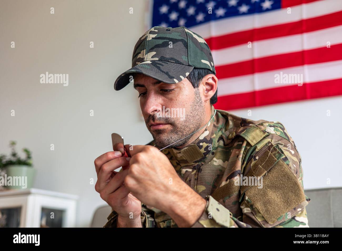 Depressed veteran holding identification hi-res stock photography and ...