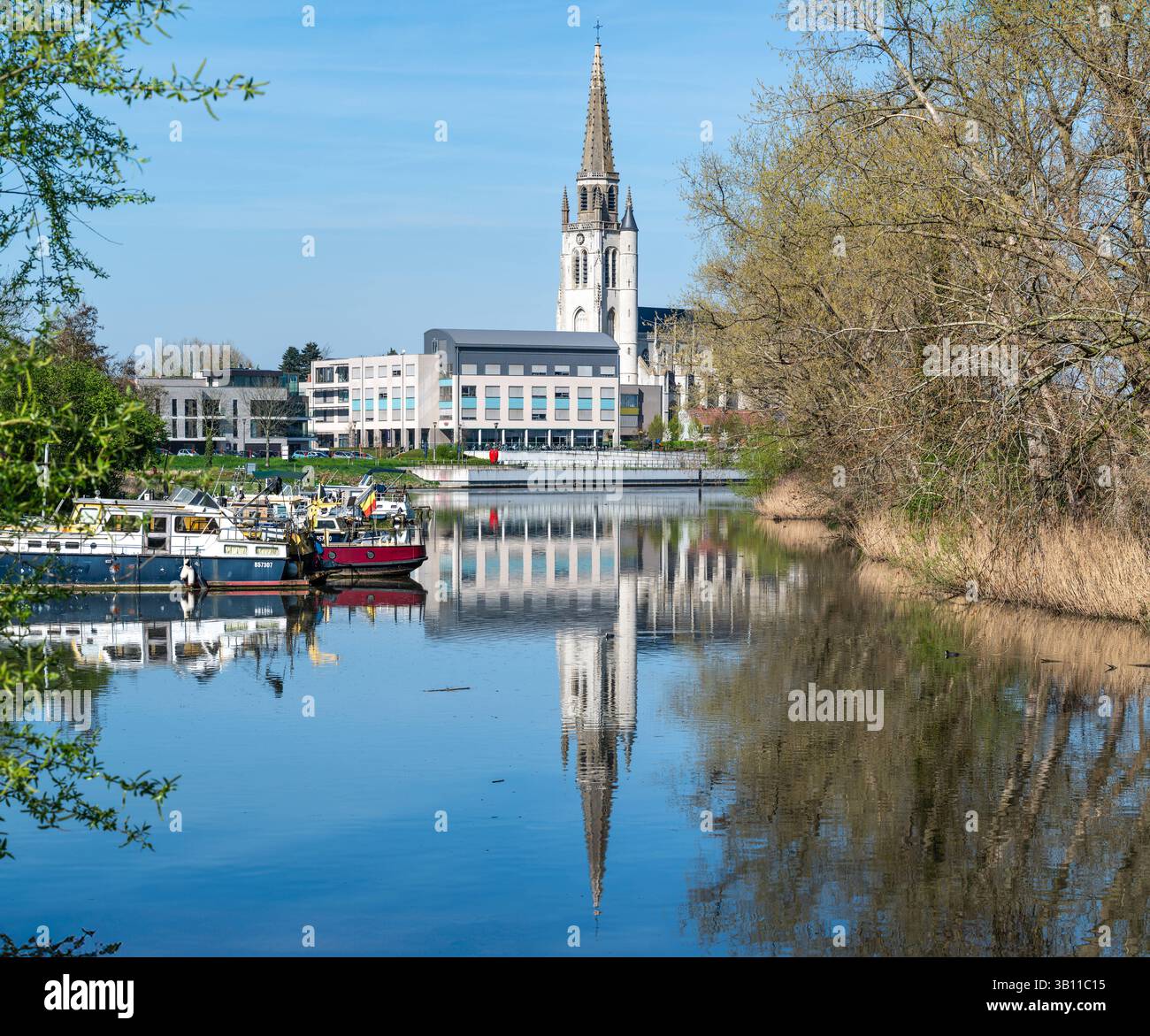View over the village and Saint Medardus church reflecting in the river ...