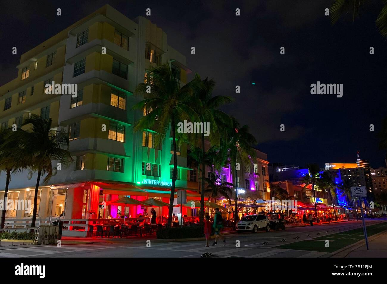 Miami Beach Ocean Drive at night with neon lights and palm trees Stock ...